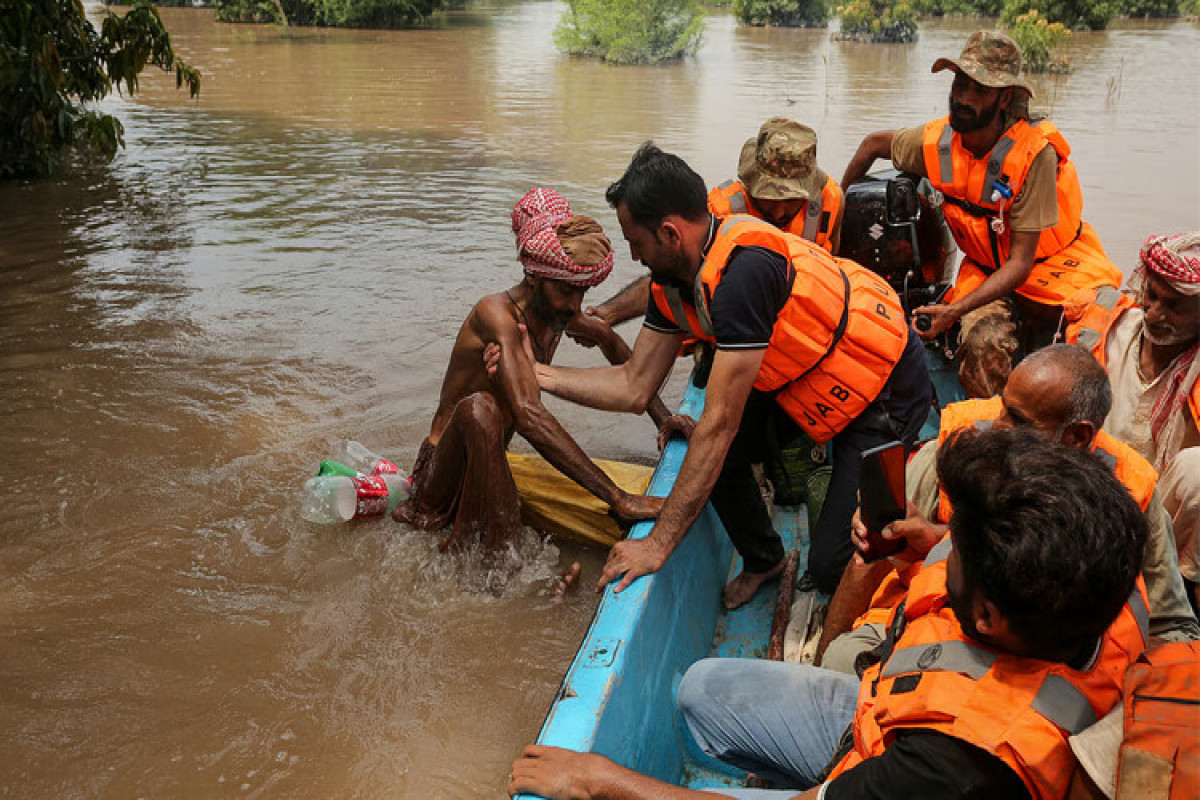 Boat capsizes in Pakistan floods, killing nine, authorities say