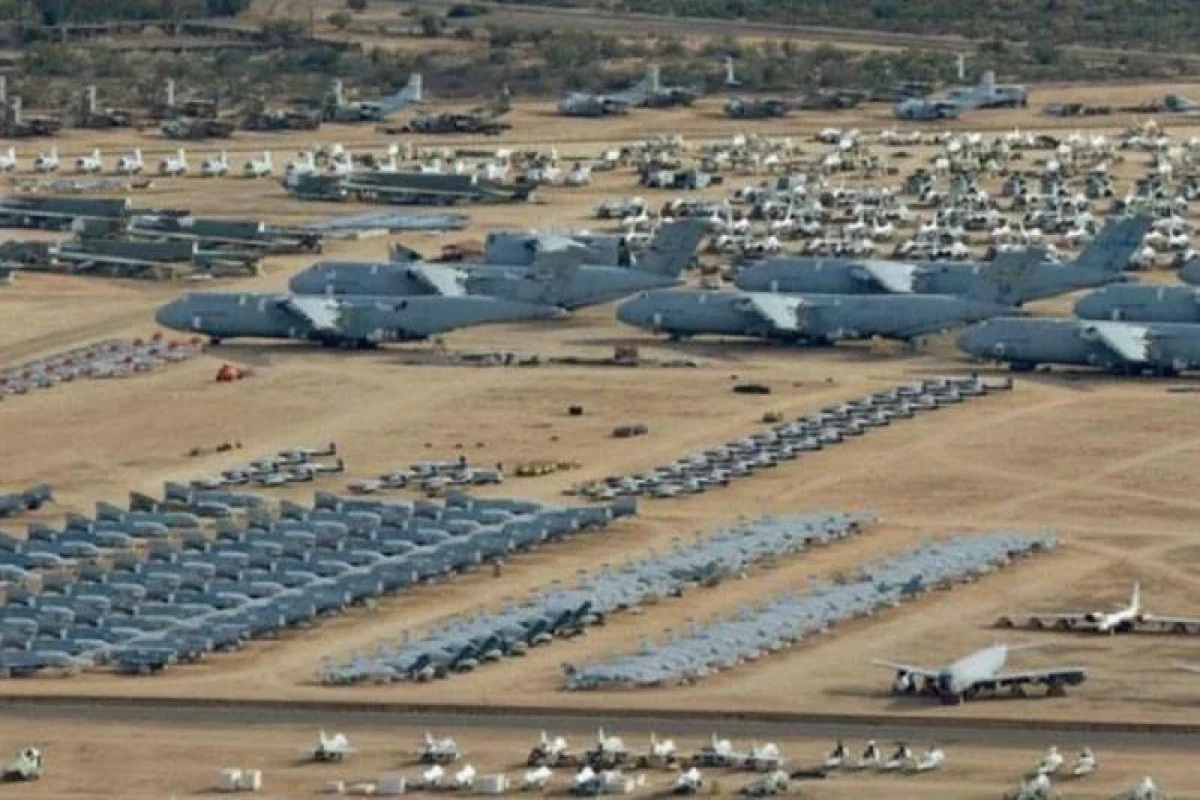US lowers security alert at Qatar air base, sources say